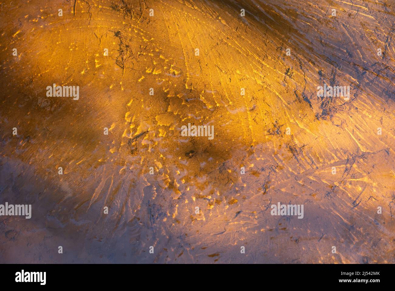 yellow sand is visible through the clear water of the river in the sun ...