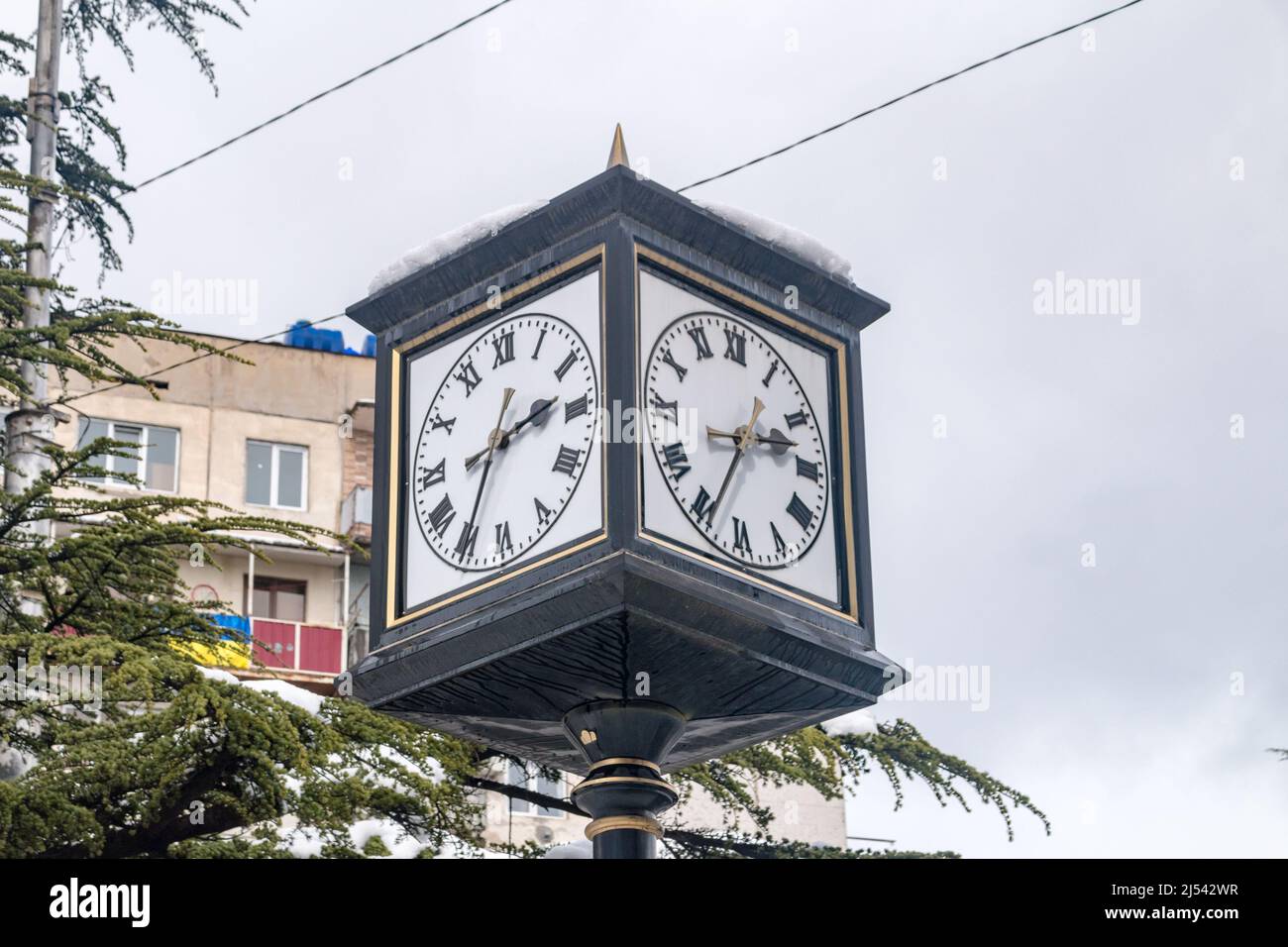 Street clock on a pole Stock Photo - Alamy