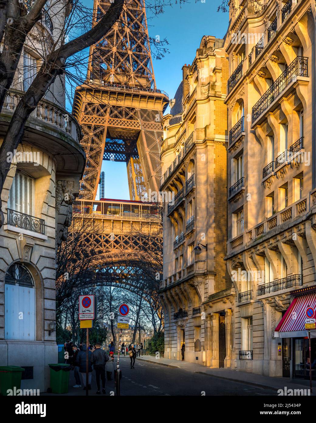 Paris, France - February 7, 2022: Eiffel tower between haussman ...