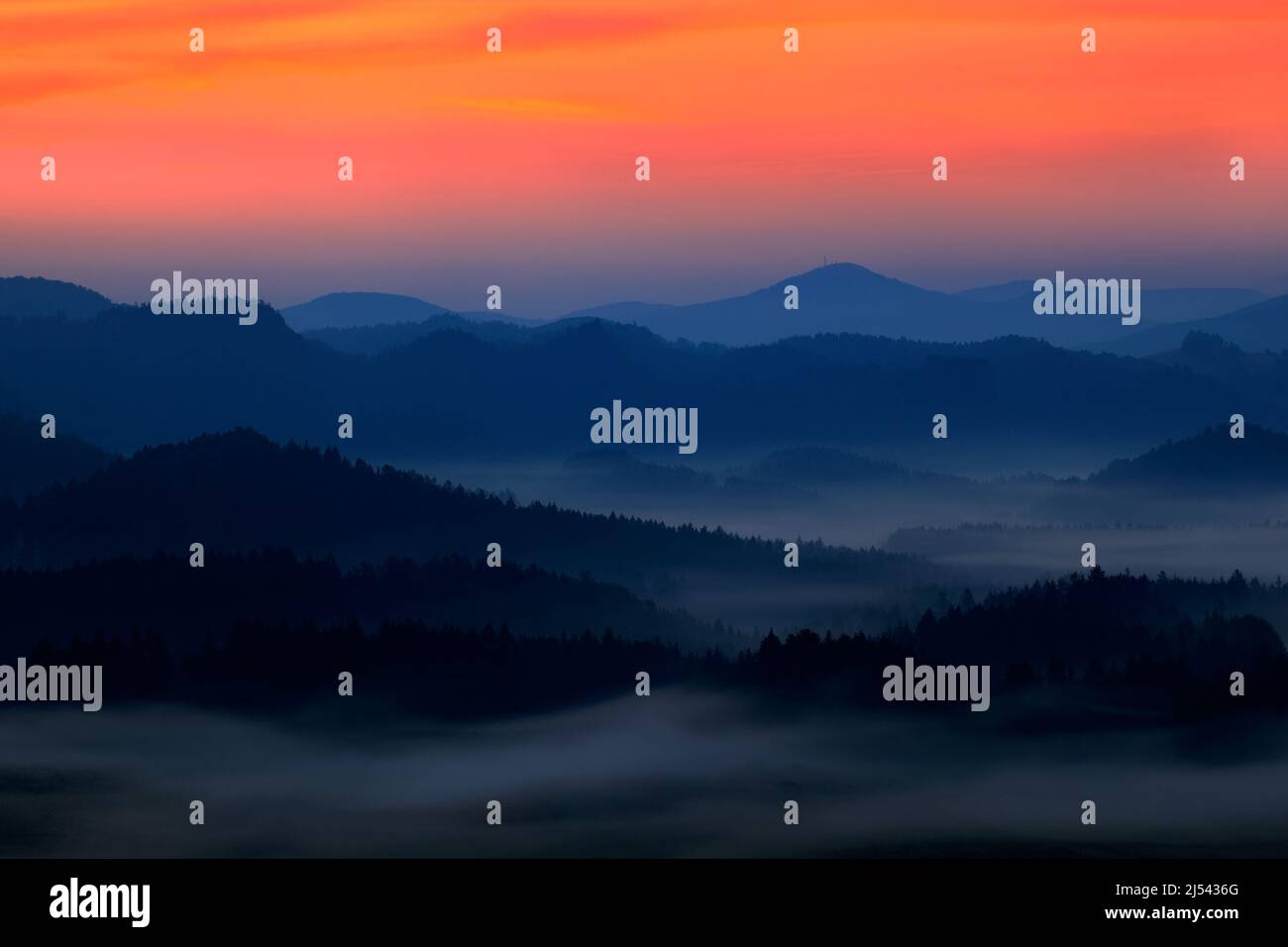 Cold misty foggy morning with twilight sunrise in a fall valley of ...