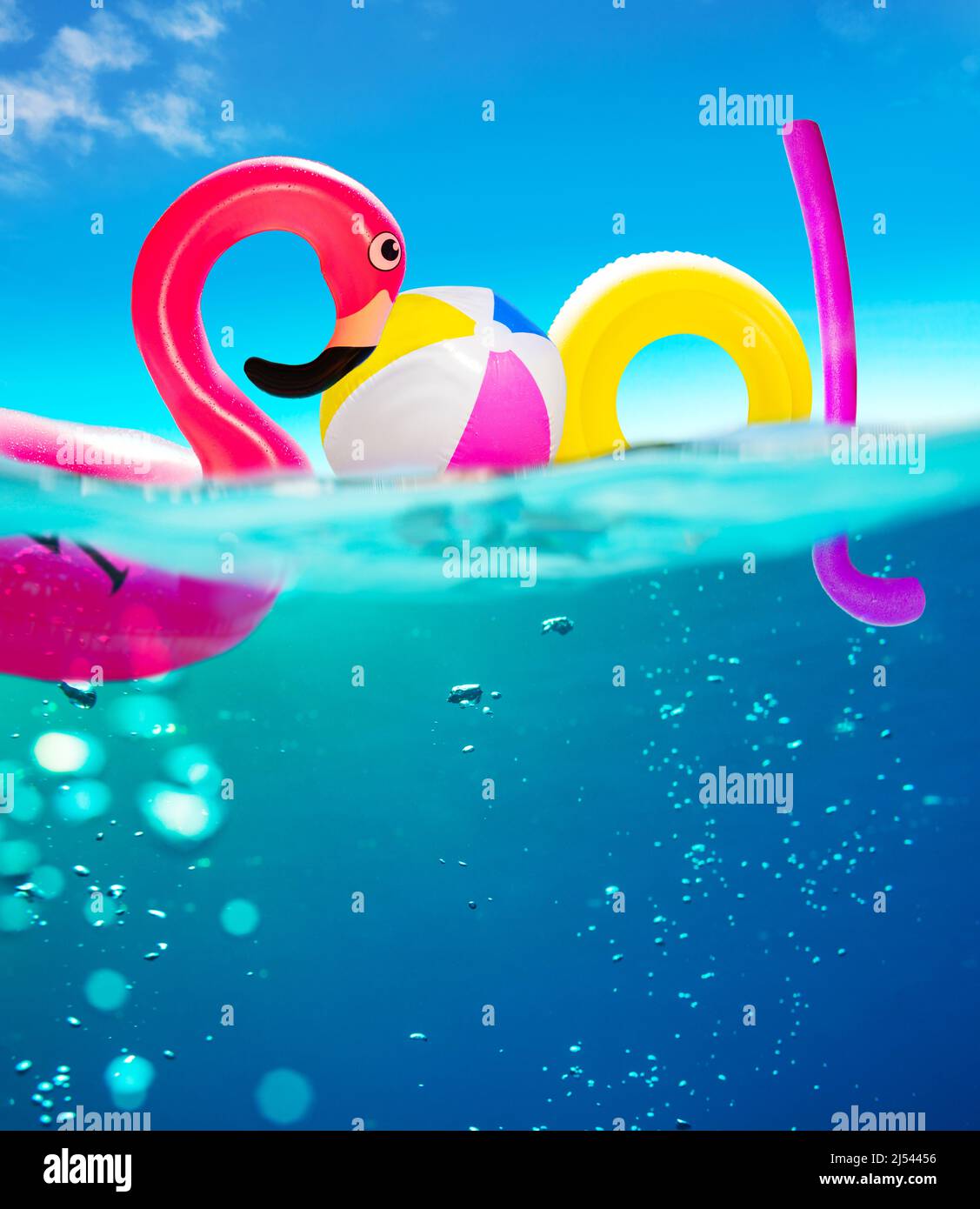 Pool text made of inflatable water toys underwater split photo Stock ...