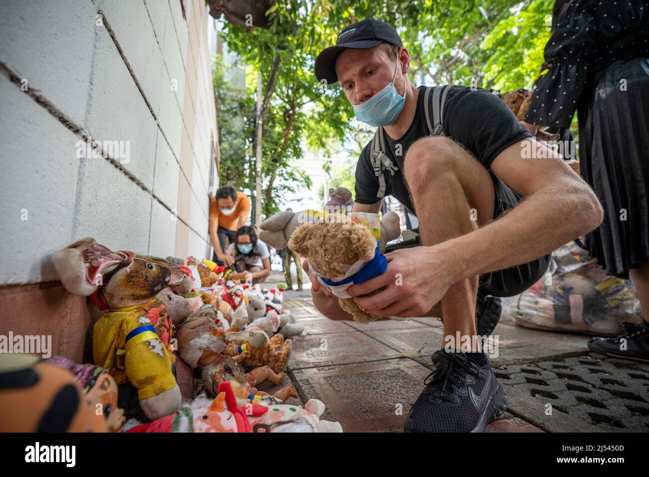 Bangkok, Thailand. 20th Apr, 2022. A man piles stuffed animals to ...