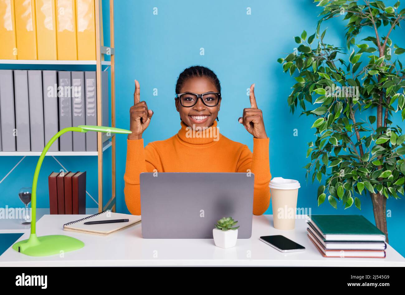 Portrait Of Attractive Cheery Girl Expert Using Laptop Pointing Up Copy Blank Space Isolated
