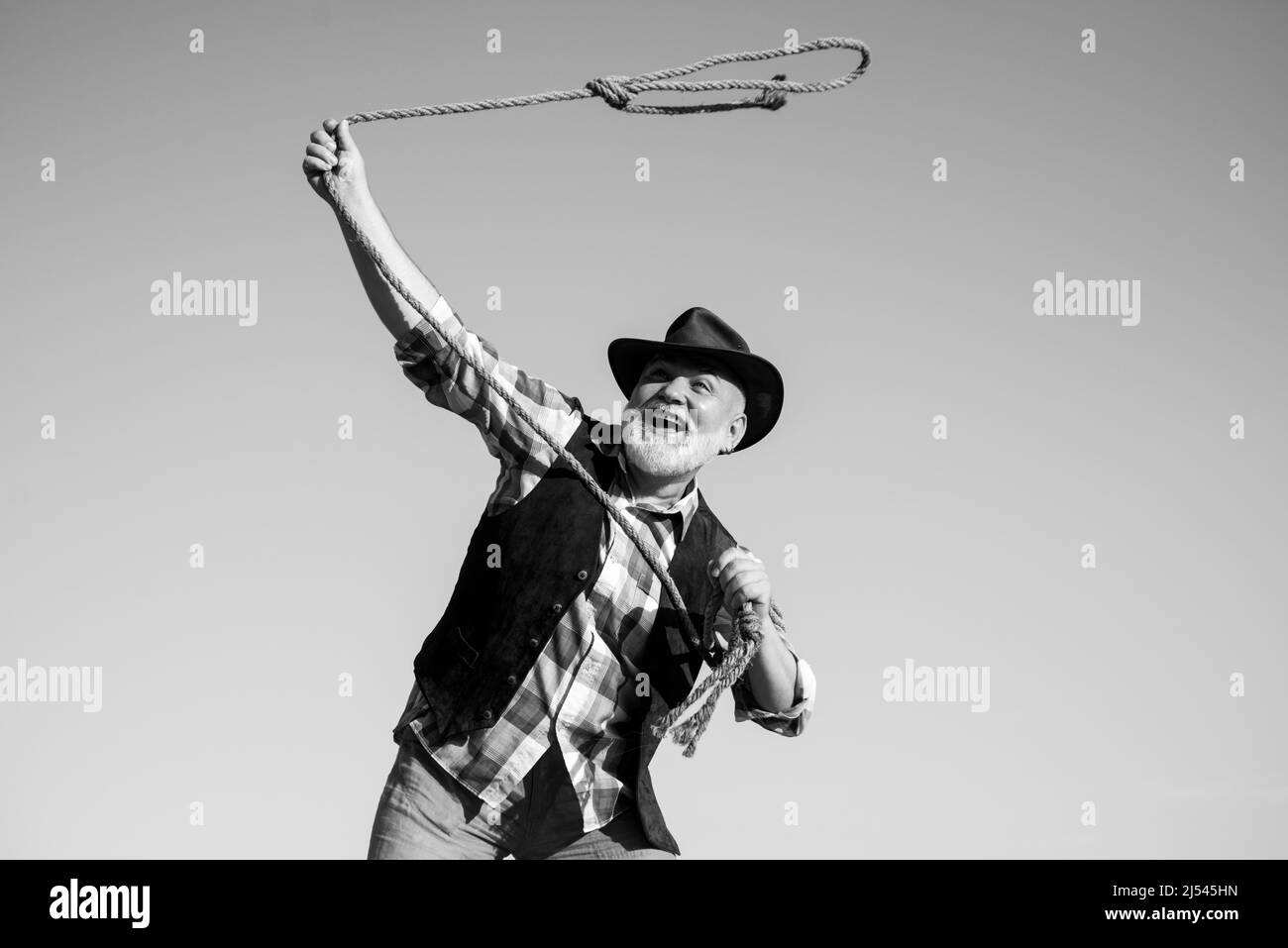 Cowboy roping cattle Black and White Stock Photos & Images - Alamy