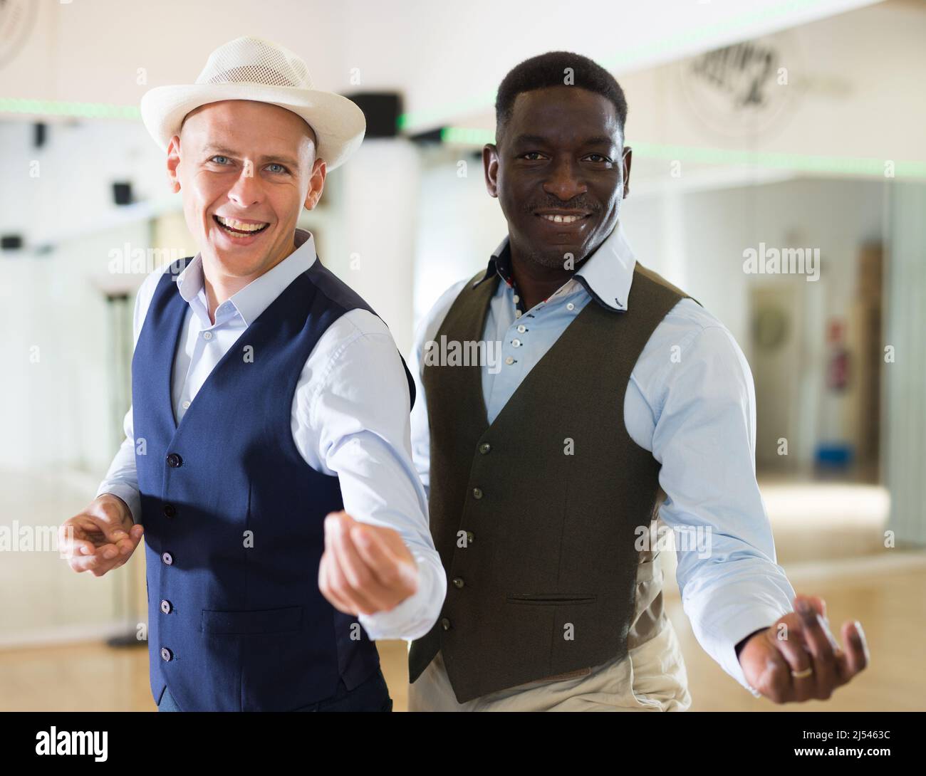 Two men dancing jazz in studio Stock Photo - Alamy