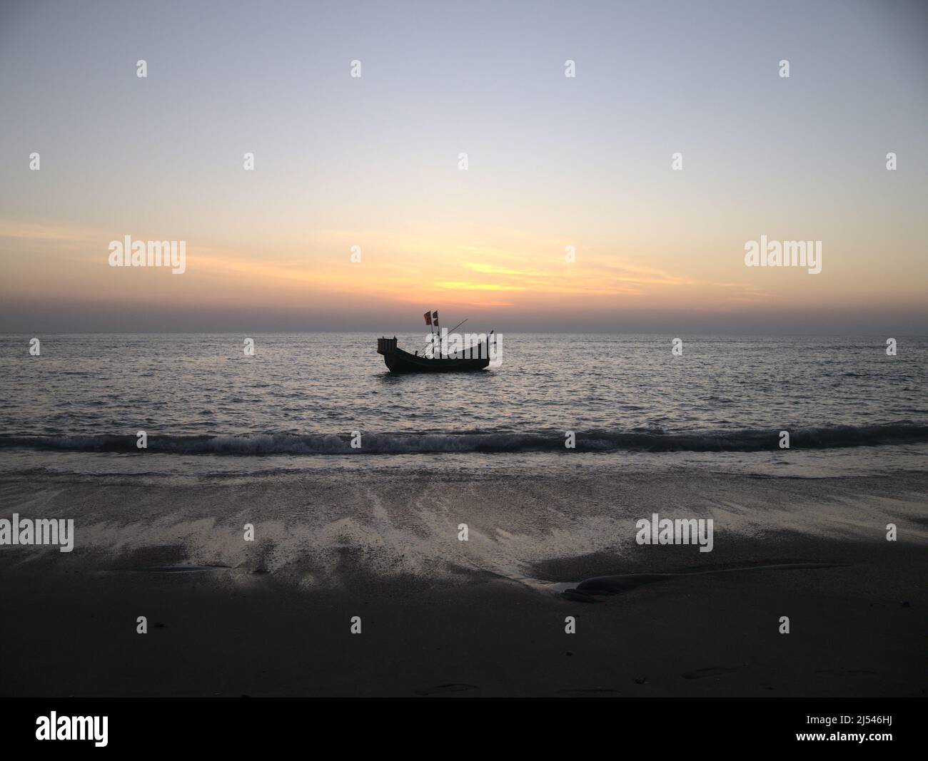 A local Balami Nouka fishing boat moored off Cox's Bazar beach ...