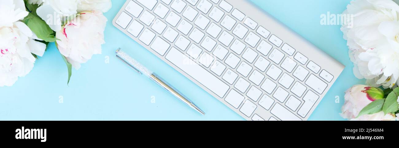 Flat lay home office workspace on blue Stock Photo - Alamy