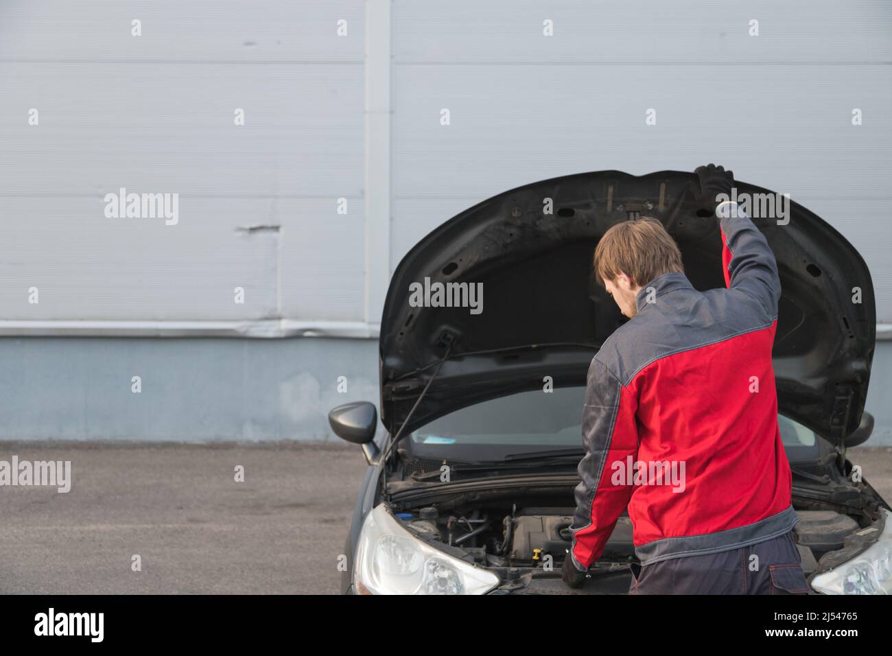 Mechanic opened hood to inspect condition of car. technical inspection ...