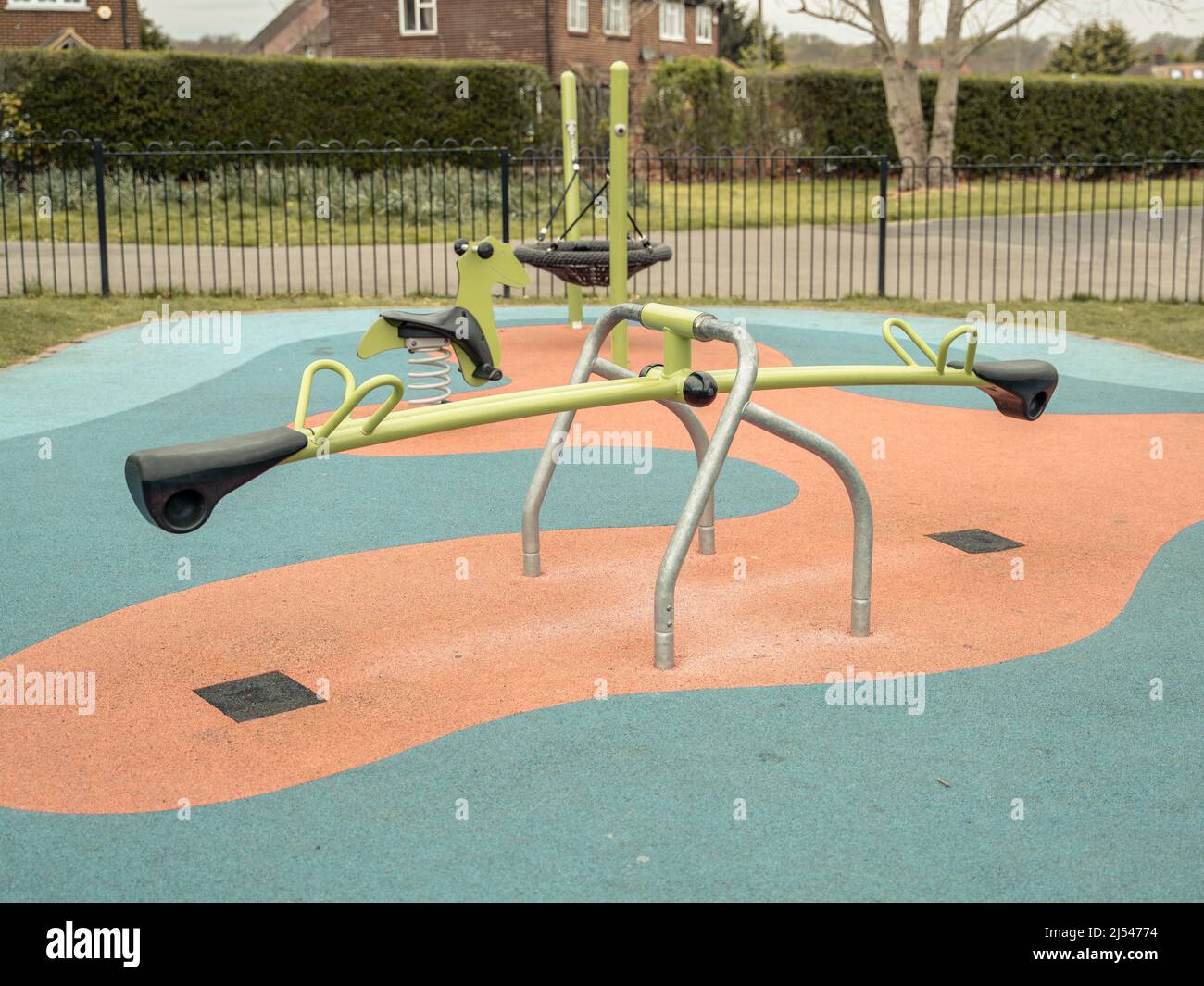 New Barnet, London, UK - April 11, 2022: A green seesaw, in a children ...