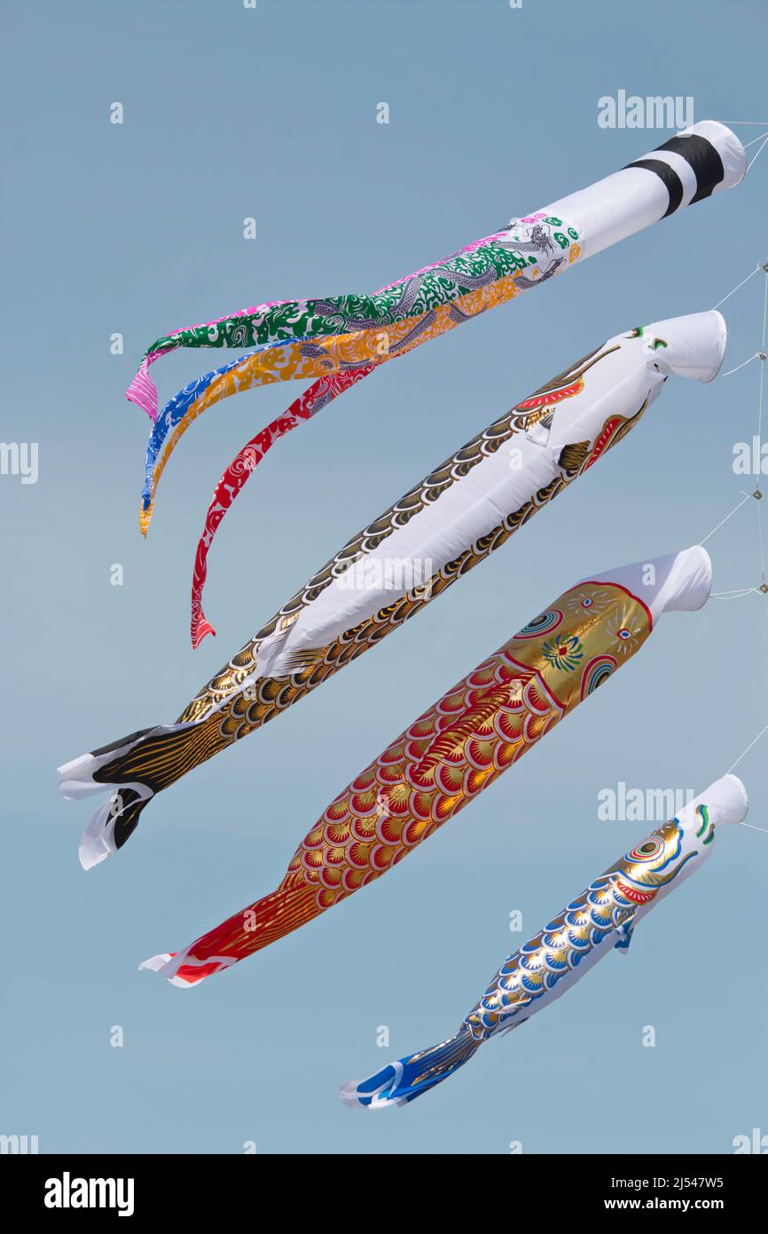 Four fish-shaped flags flying in the wind Stock Photo - Alamy