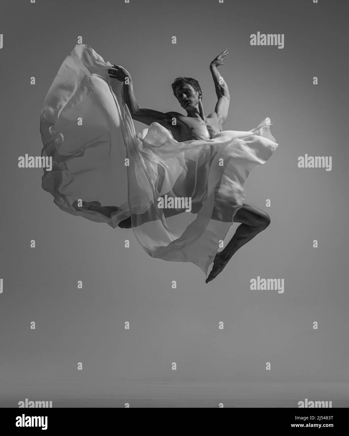 Hope. Black and white portrait of graceful muscled male ballet dancer ...