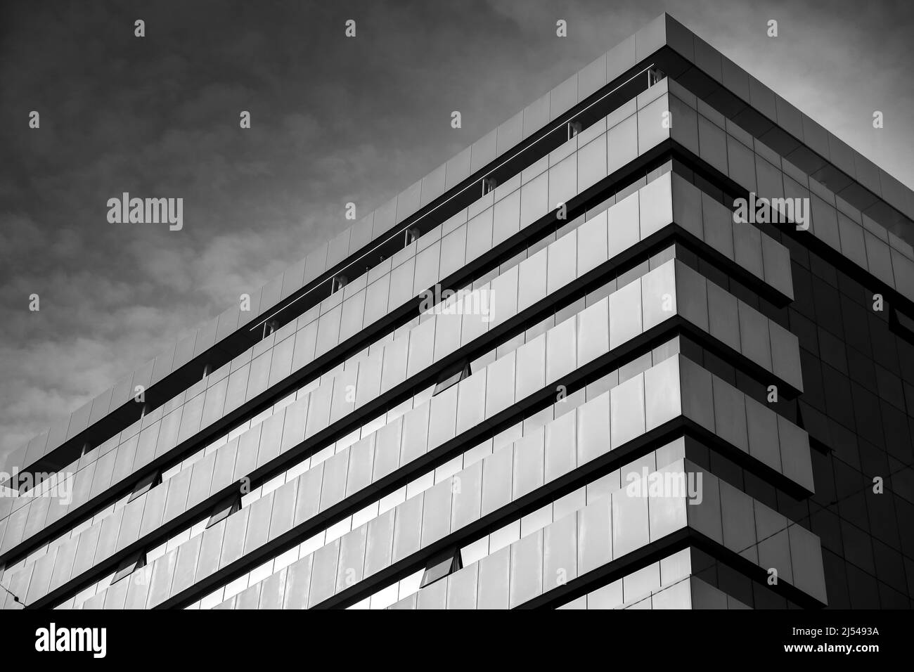 Rectilinear and geometric facade with glass windows Stock Photo - Alamy