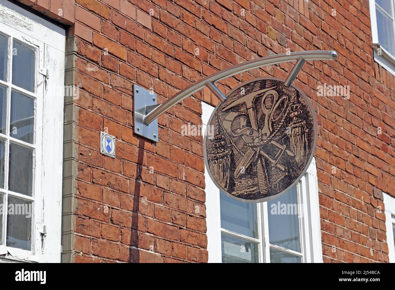 Heritage-protected house with guild symbol of the tailors at the Dutch ...