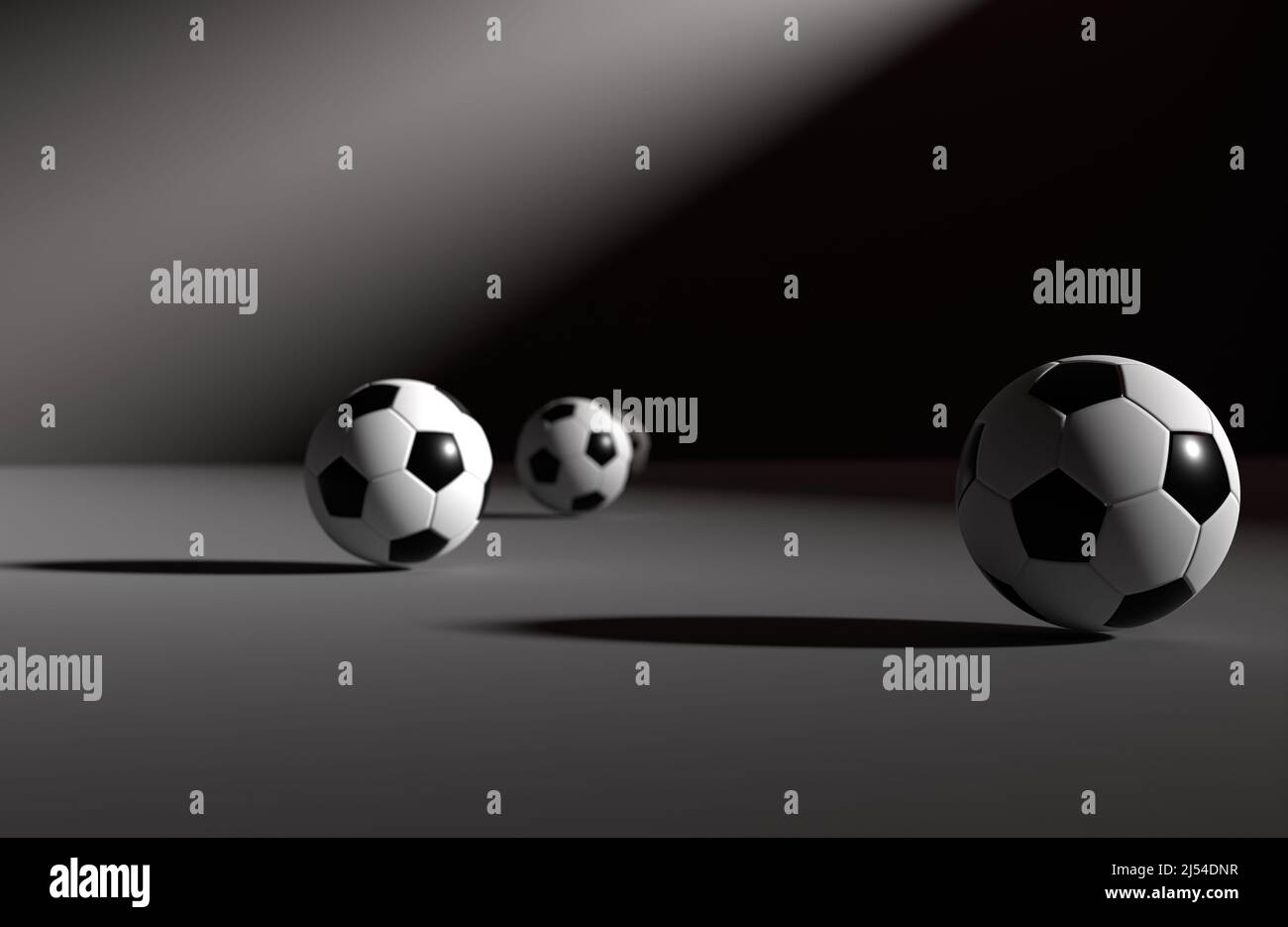 Several soccer balls in a dark room with rays of light. Workout ...