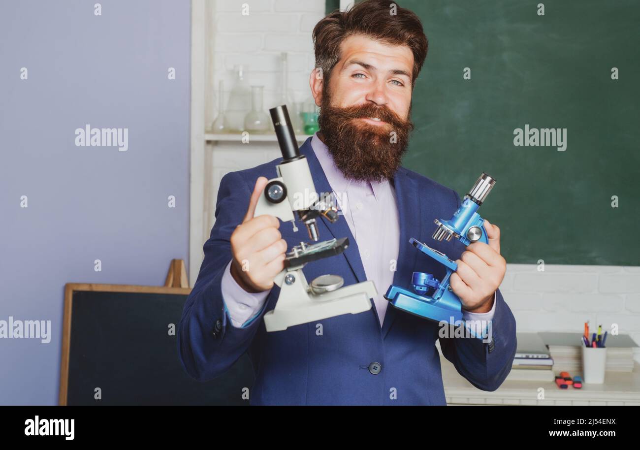 Portrait of teacher man with microscope, professor, tutor, mentor in ...