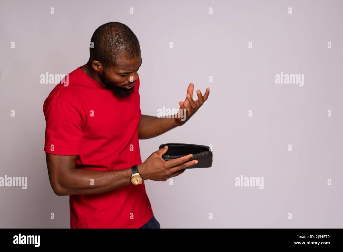 Man holding empty black wallet hi-res stock photography and images - Alamy