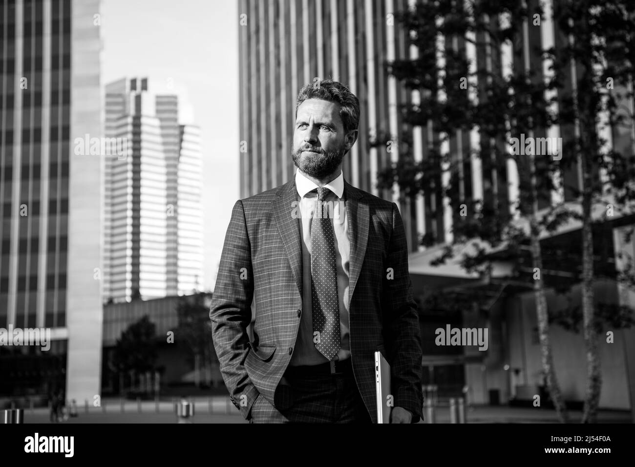 Businessman with success business. Outdoors portrait male model in suit ...