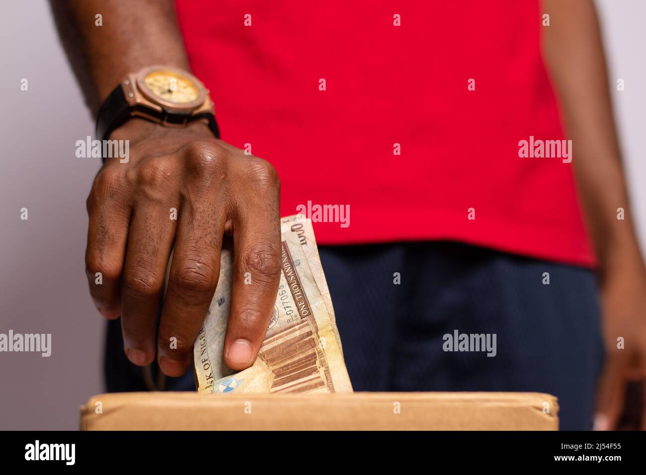 African saving money hi-res stock photography and images - Alamy