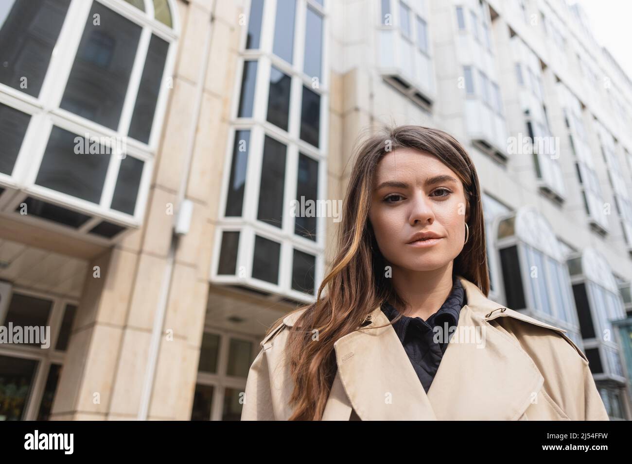 Woman low angle trench hi-res stock photography and images - Alamy