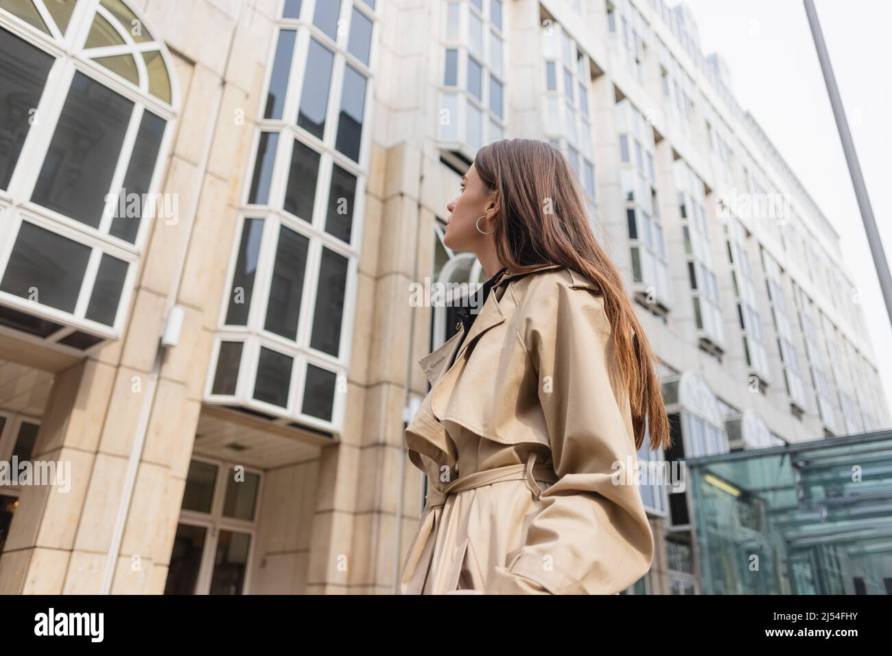 Woman low angle trench hi-res stock photography and images - Alamy