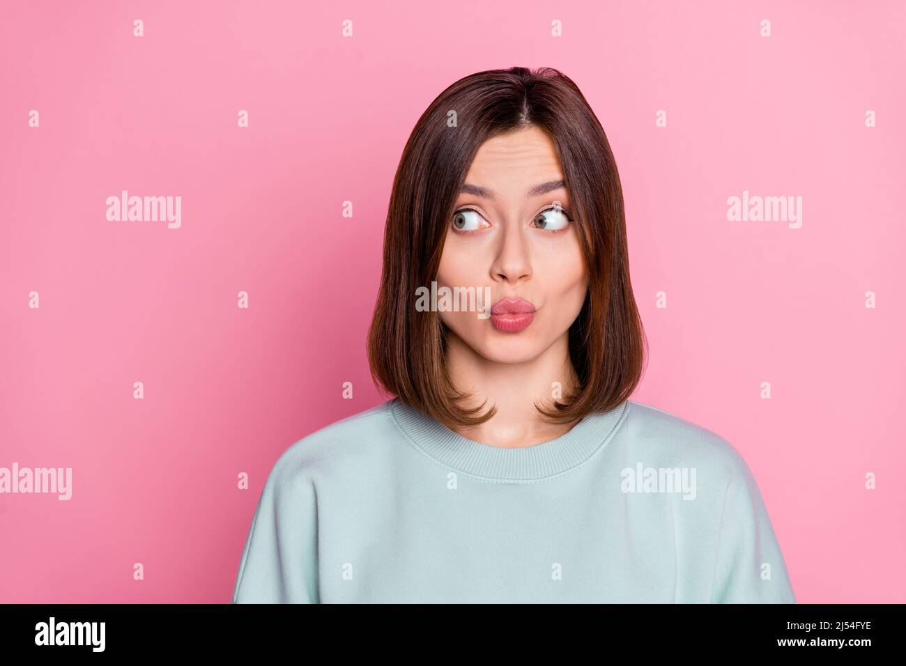 Photo of young pretty lady interested look empty space pouted lips ...