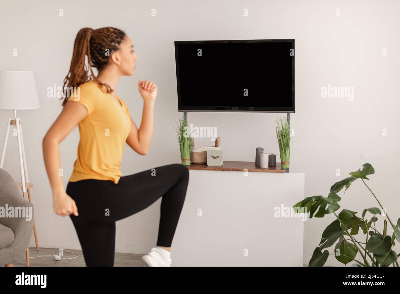 Woman exercise television hi-res stock photography and images - Alamy