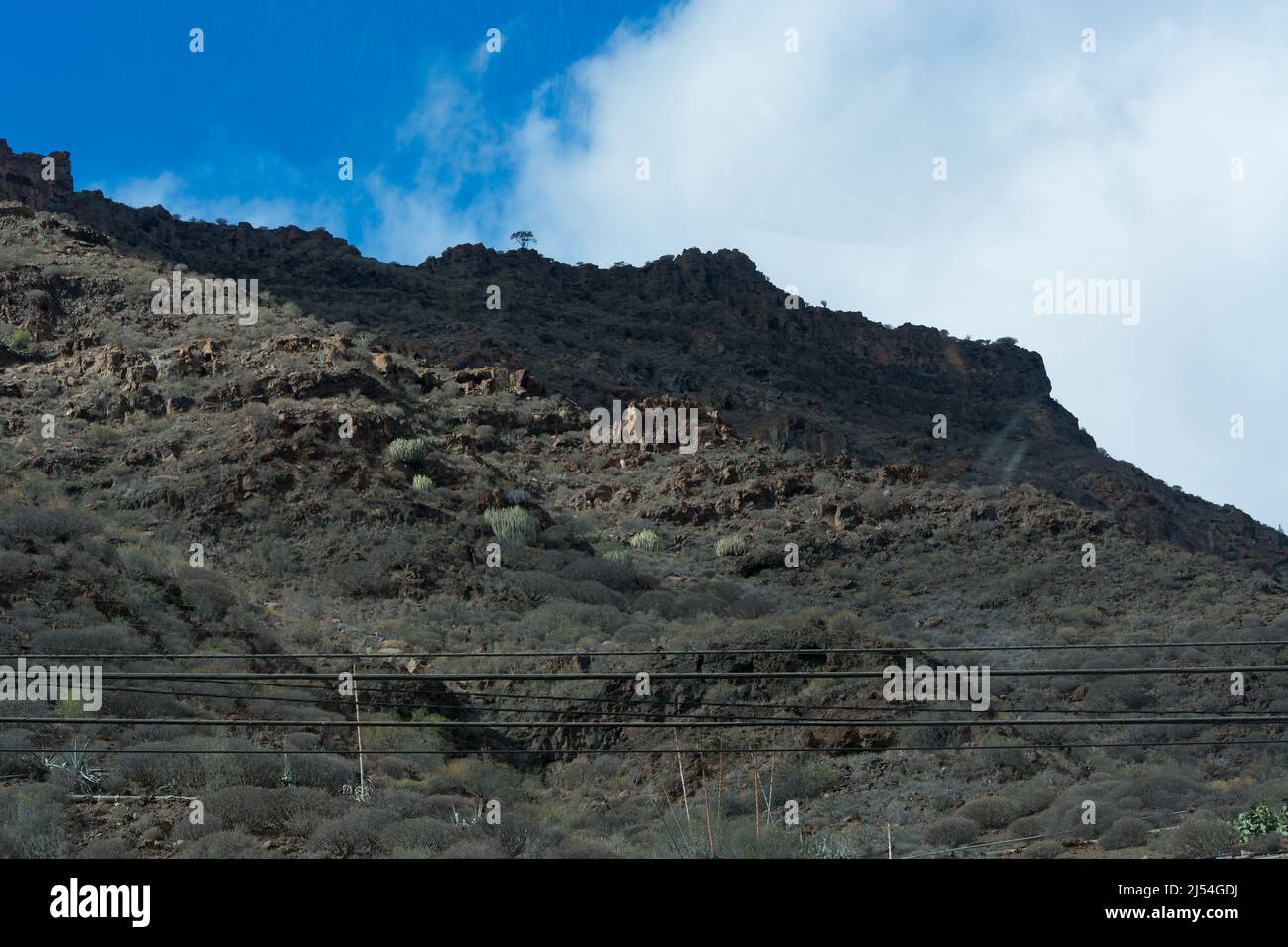 Mountains on the coast between Puerto de Mogan and Puerto Rico. Layers ...