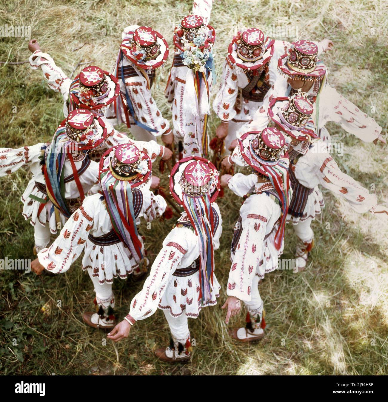 Group of young Romanian males performing a traditional ritual dance ...