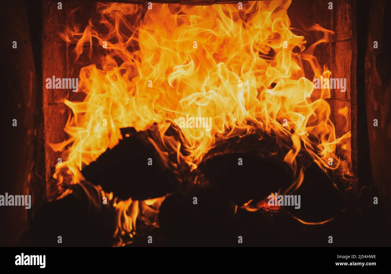 Burning wood. Cozy fire with logs. Christmas fireplace. Fire texture ...