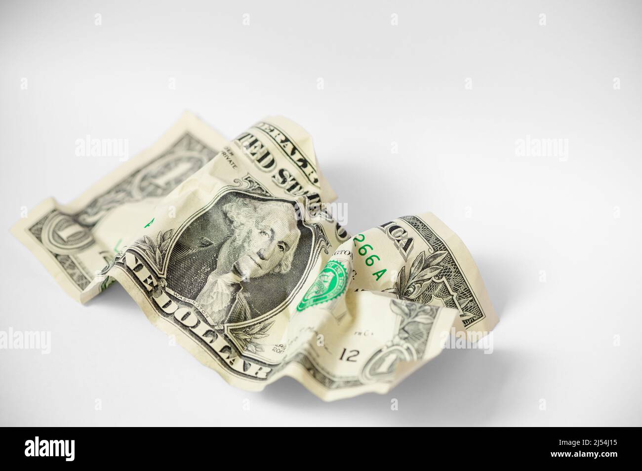 Crumpled dollar bills on white background Stock Photo - Alamy