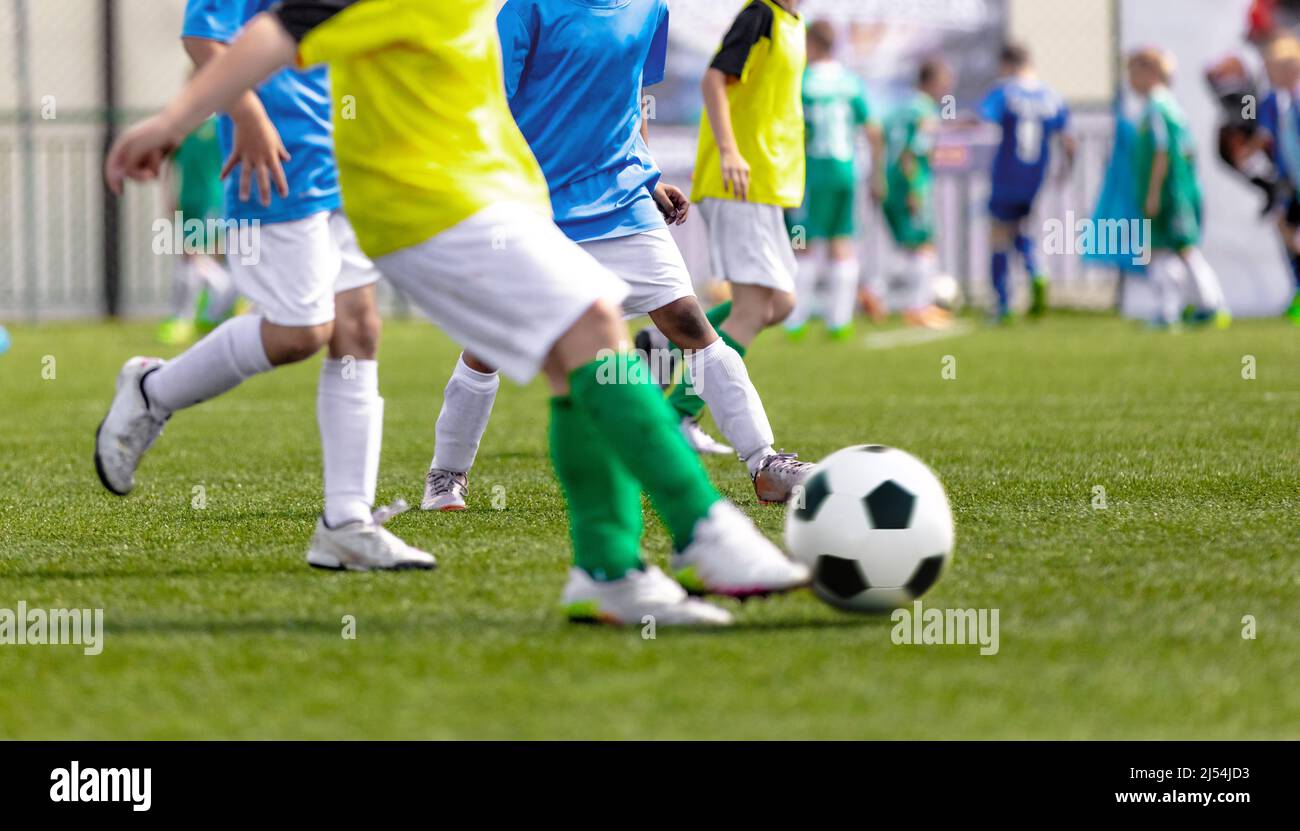 Football Boys Kicking Ball in Opposite Teams. Young Soccer Players ...
