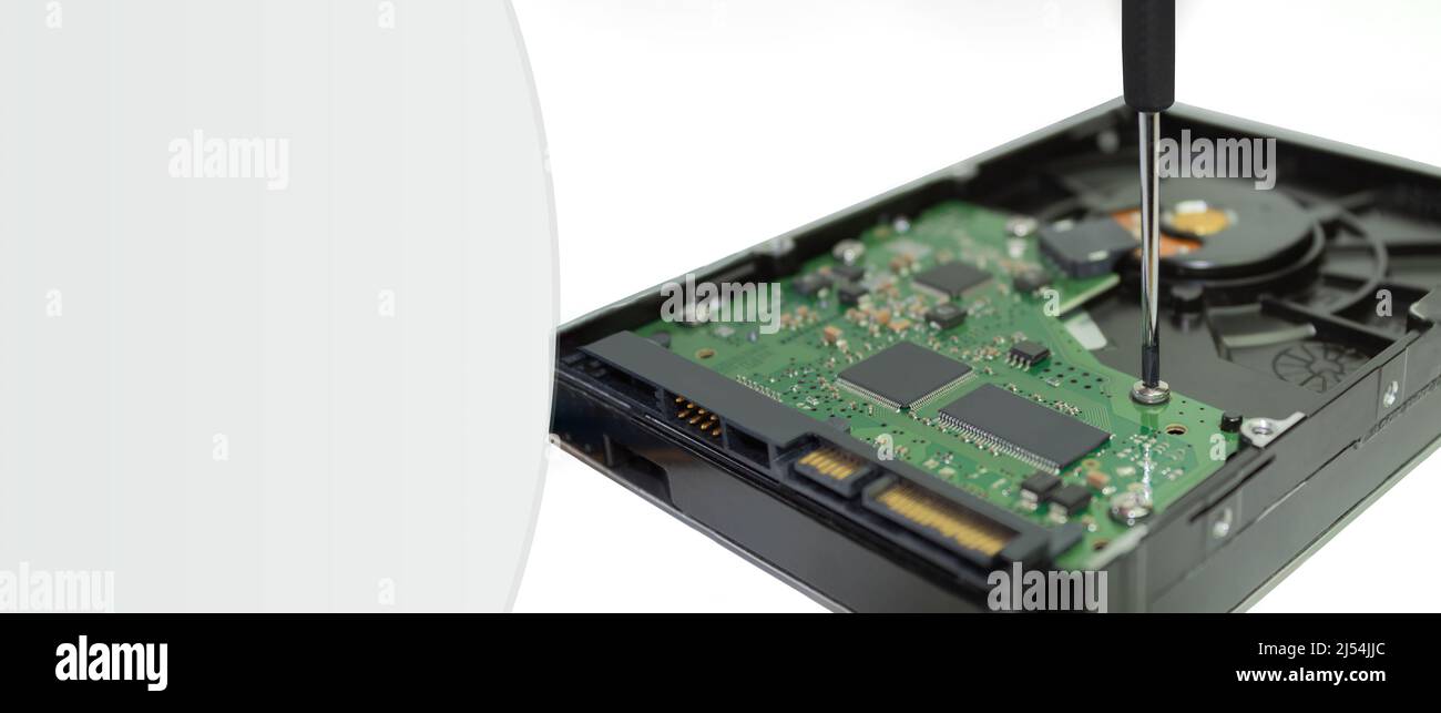 Computer hard drives HDD and a screwdriver on a white background ...