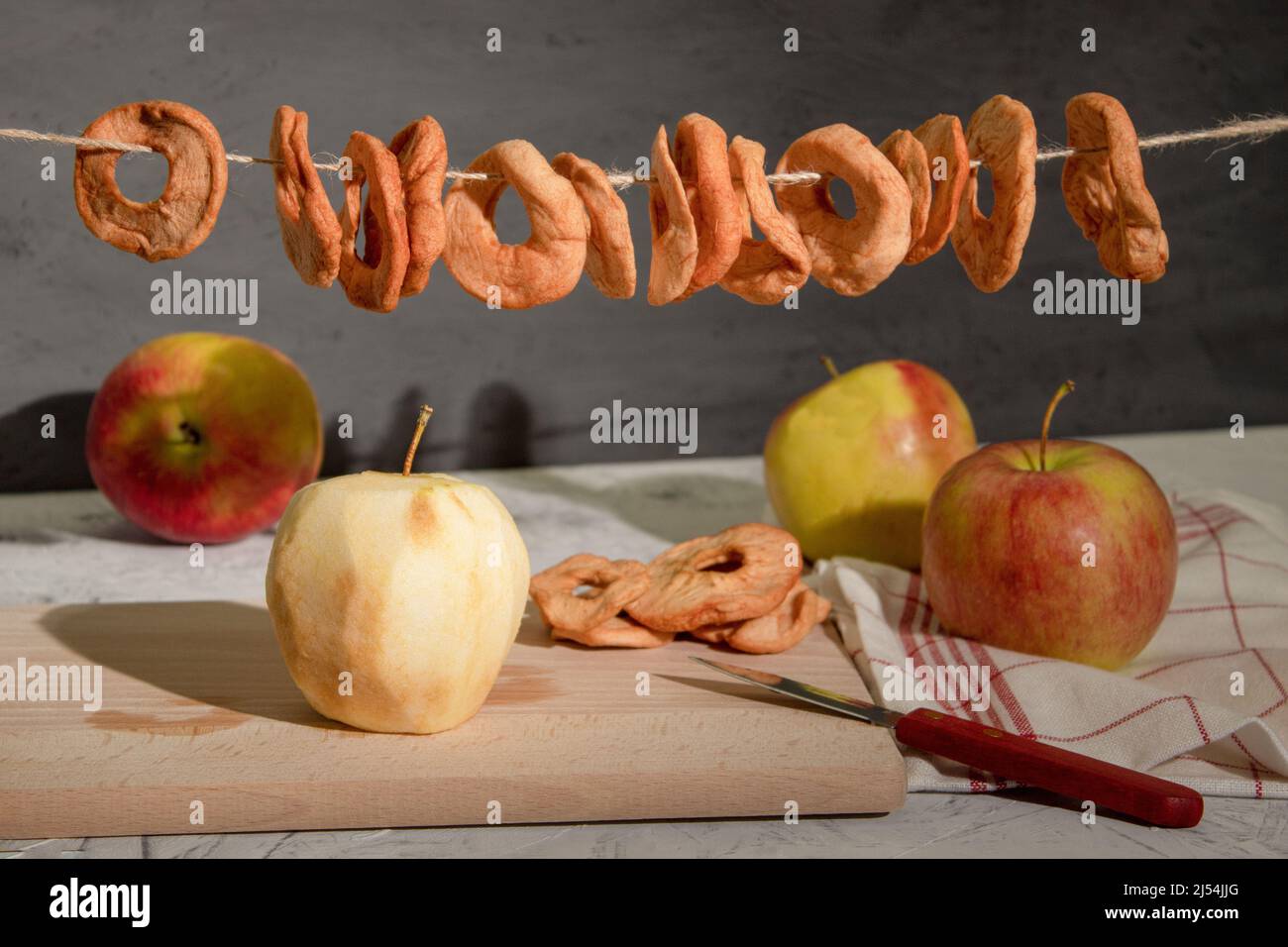 Peeled ripe red apple on a kitchen countertop, side view. Background ...