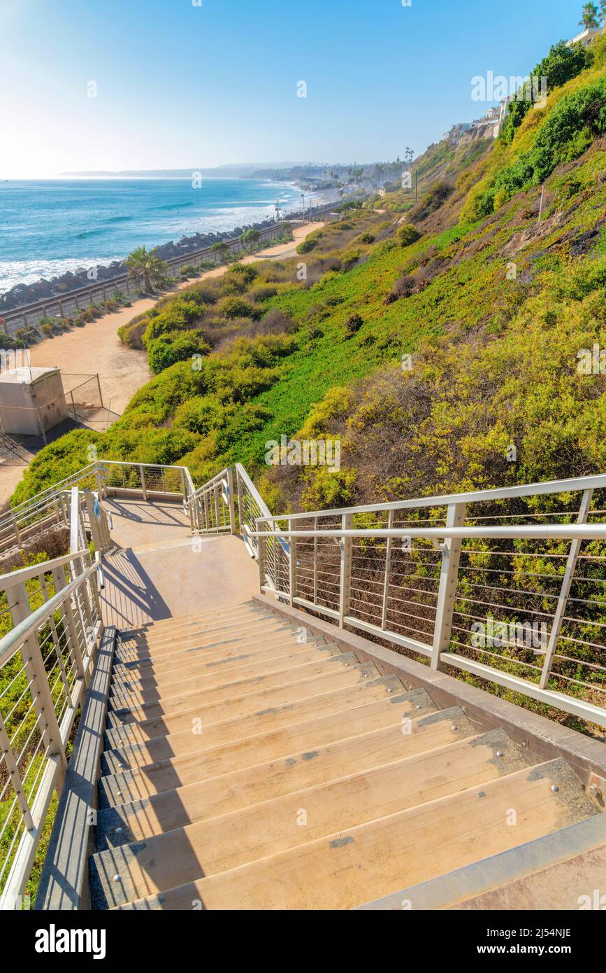 High angle view of an outdoor staircase with wooden steps and metal ...