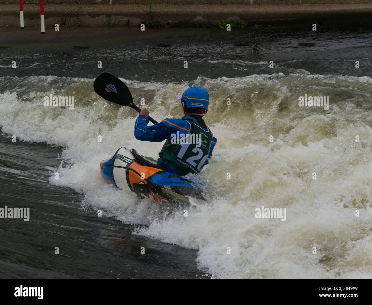 Young boy in Kayak tackling white water of Holme Pierrepont Country ...