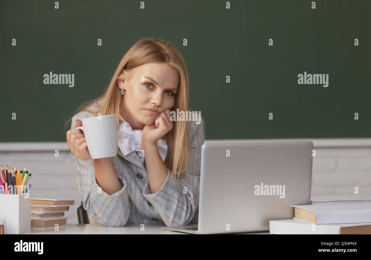 Student preparing exam and learning lessons, drinking coffee or tea in ...