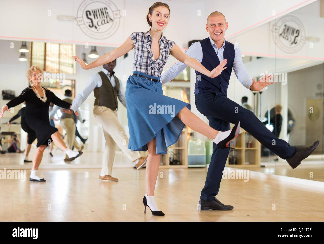 Woman and man dancing swing in studio Stock Photo - Alamy