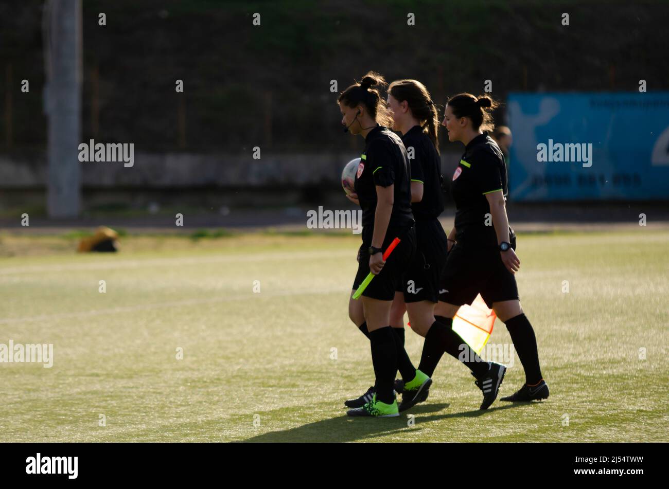 Female football referees leaving the field Stock Photo - Alamy