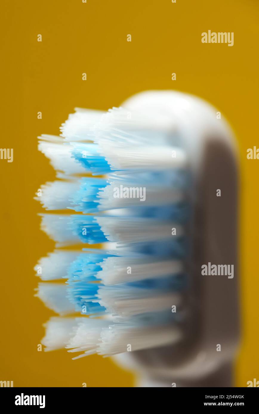 Electric ultrasonic toothbrush bristles on yellow background Stock ...