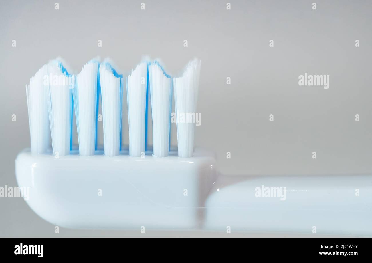 Electric ultrasonic toothbrush bristles on grey background Stock Photo ...