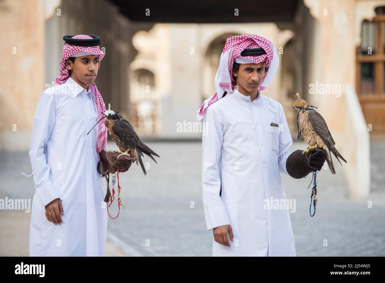 Doha ,Qatar-April 15,2022 : Qatari children with a falcon in the area ...