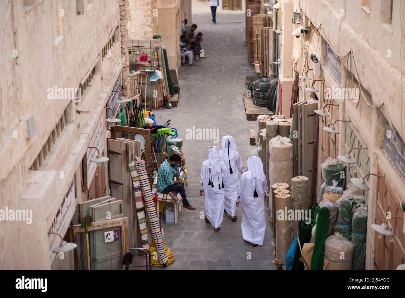 Doha,Qatar - April 15,2022 : Qatari locals in traditional attire hang ...