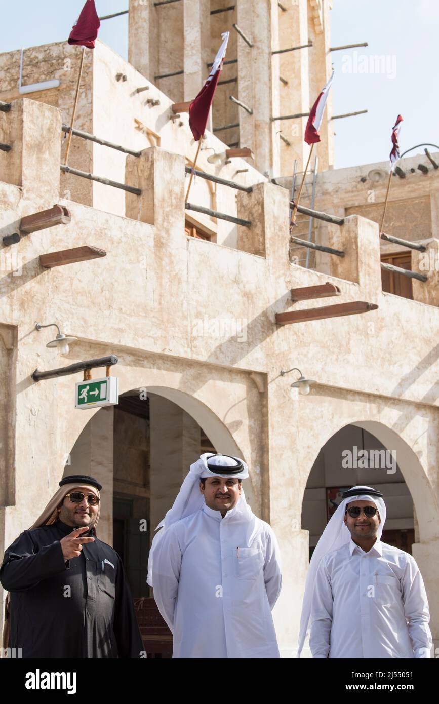 Doha,Qatar - April 15,2022 : Qatari locals in traditional attire hang ...