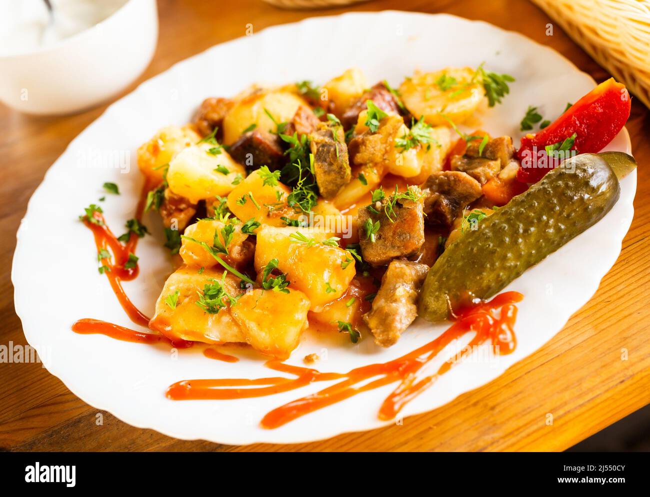 traditionally Russian dish of stewed potatoes with meat. Zharkoe po ...
