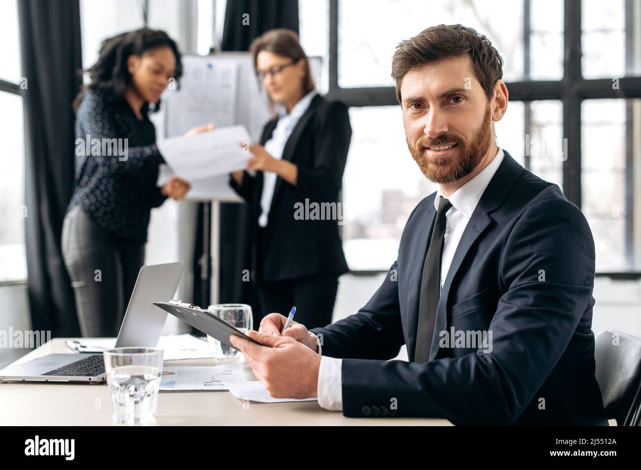 Portrait of handsome caucasian male business leader in formal suit at ...
