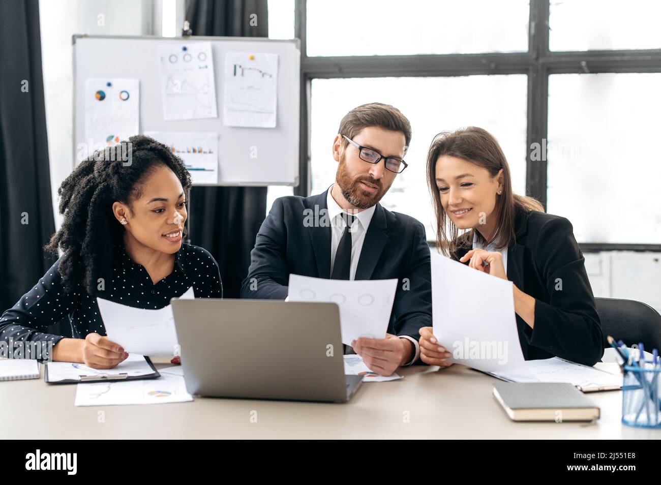 Business partners working together on a project. Multiracial colleagues ...