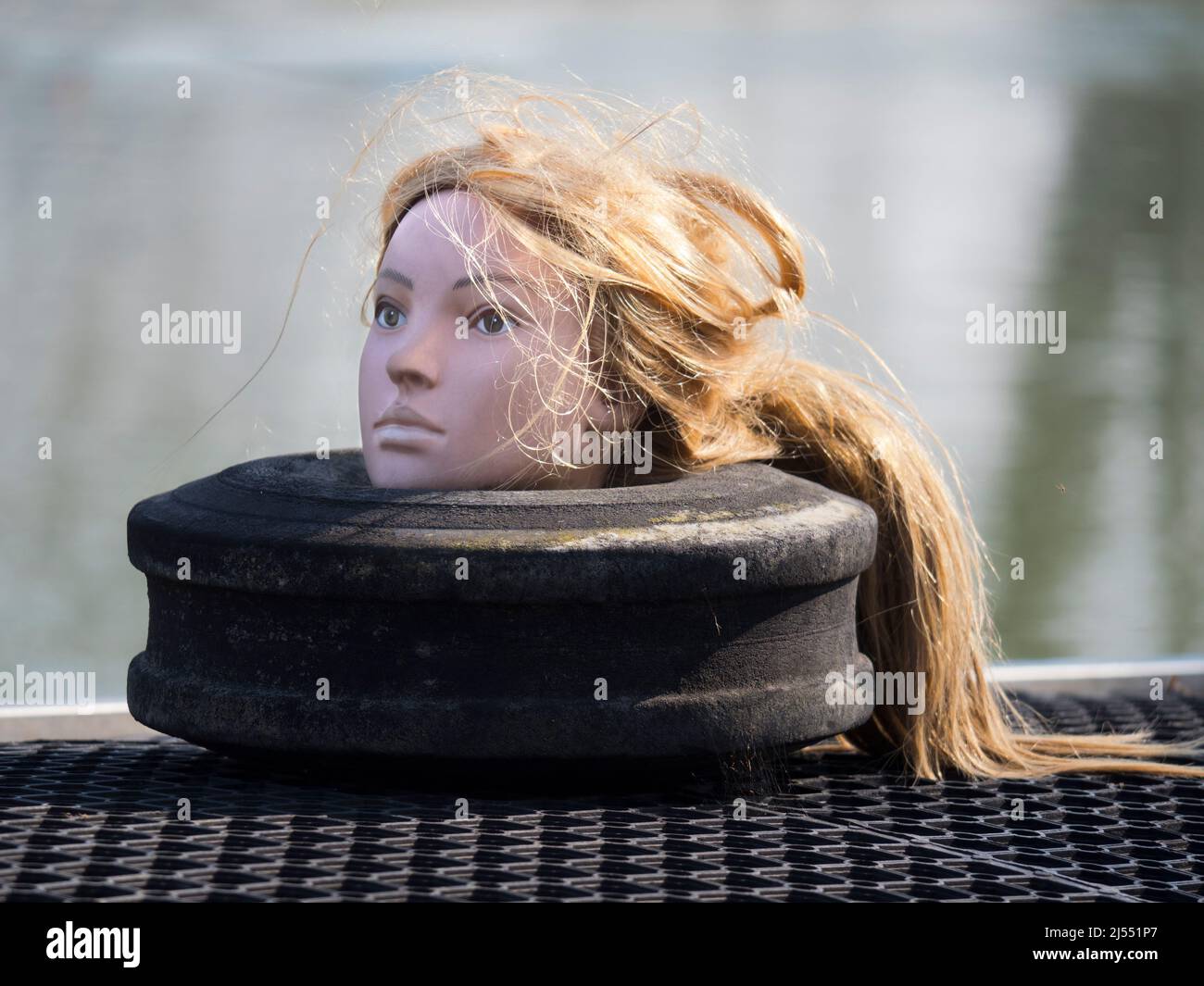 Here we see the truly surreal vision of a manikin head poking through ...