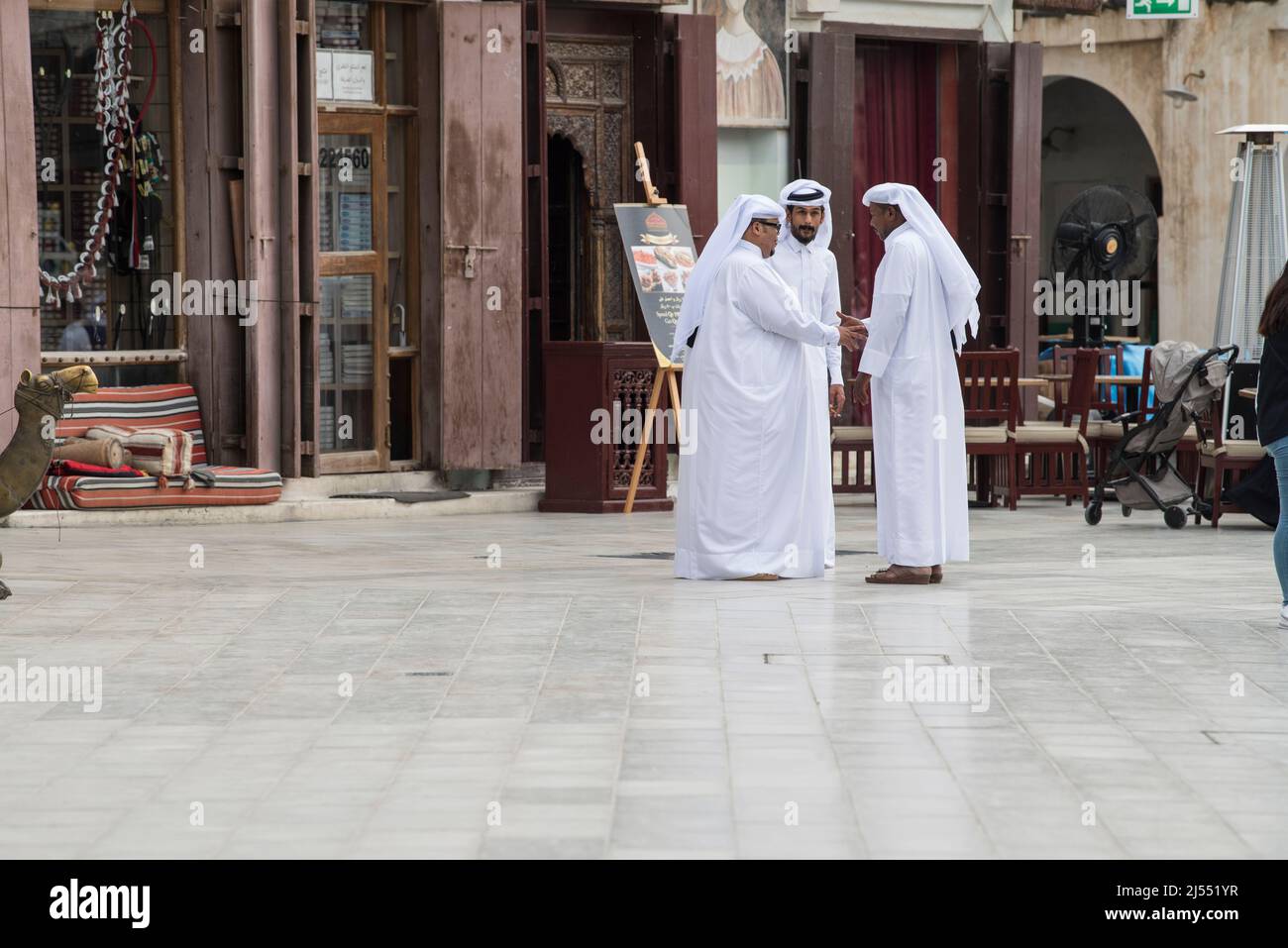 Doha,Qatar - April 15,2022 : Qatari locals in traditional attire hang ...