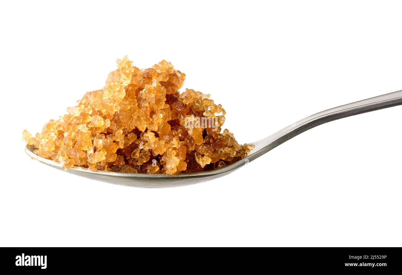 palm sugar candy or rock candy in a spoon, lump sugar made by tapping ...