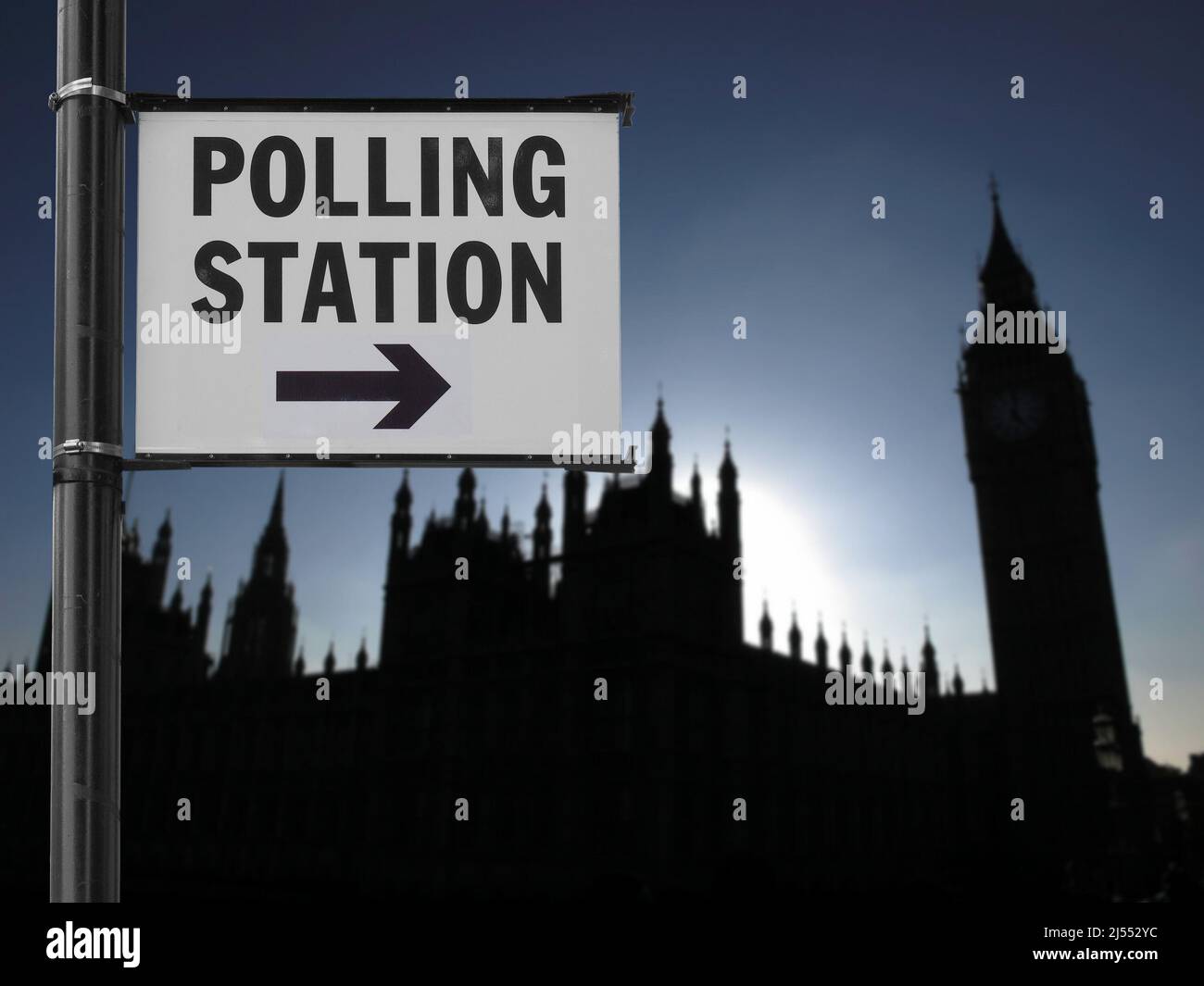 polling station sign, focus on foreground with blurred houses of ...